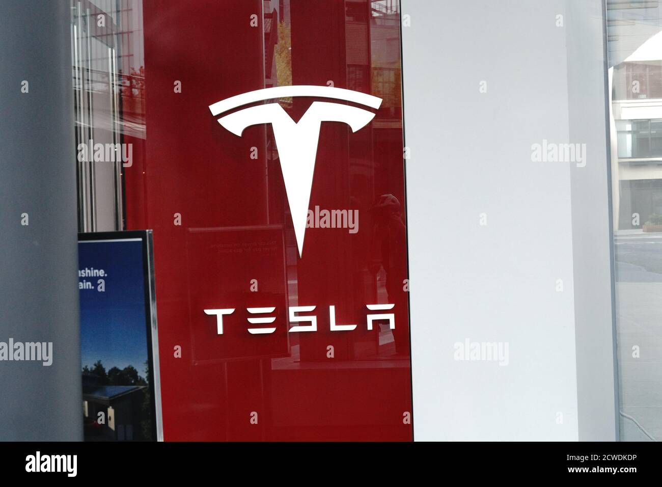 Tesla logo at their showroom.Tesla’s next factory is going to be in ...