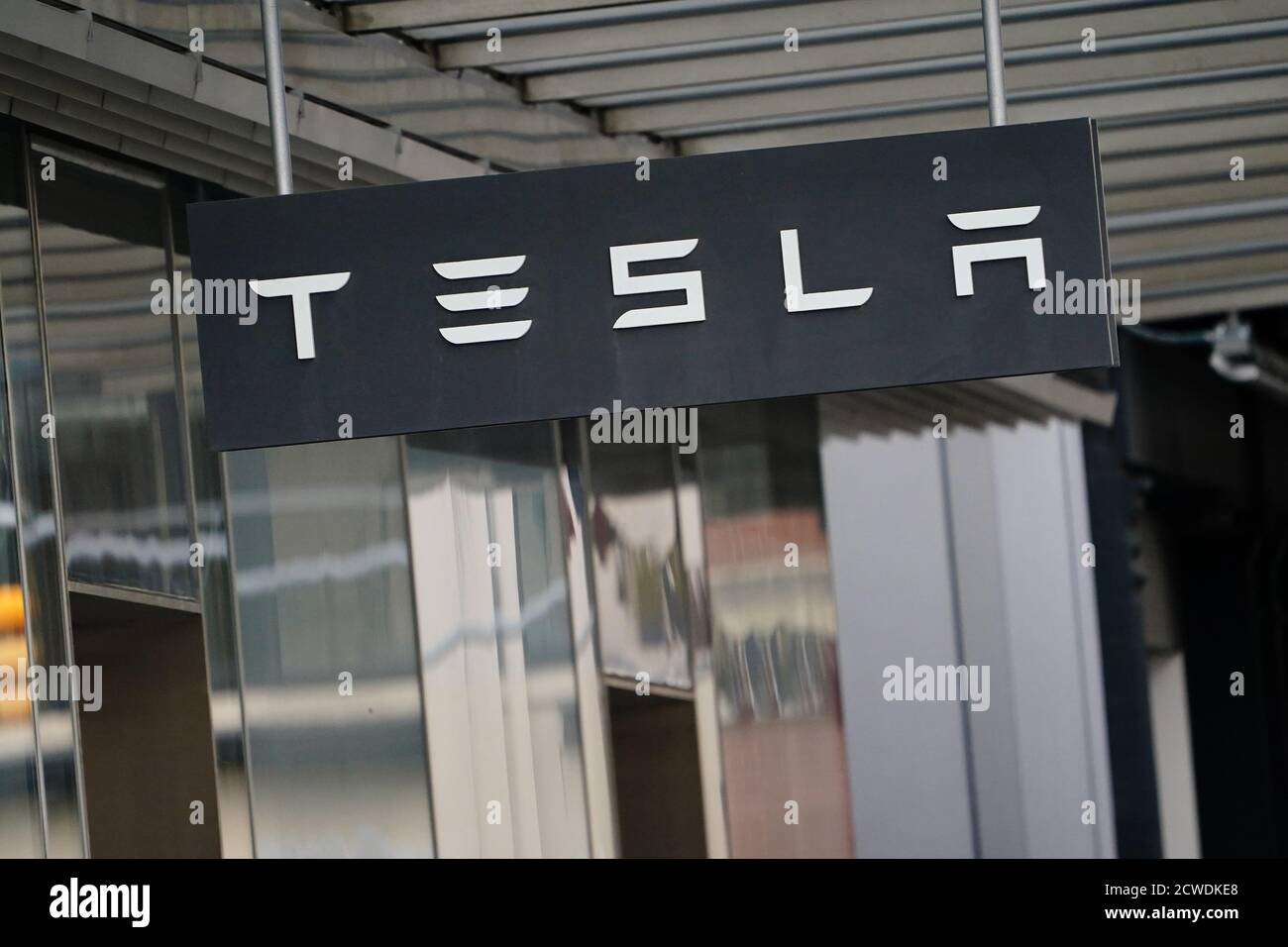 Tesla logo at their showroom.Tesla’s next factory is going to be in ...