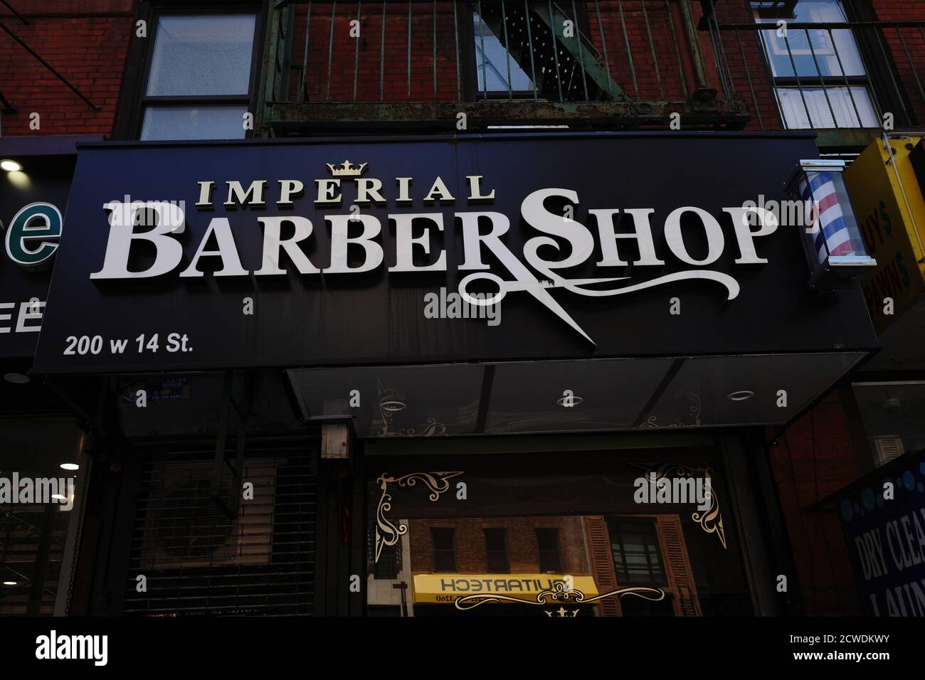 Barber shop logo seen one at one of their branches Stock Photo - Alamy