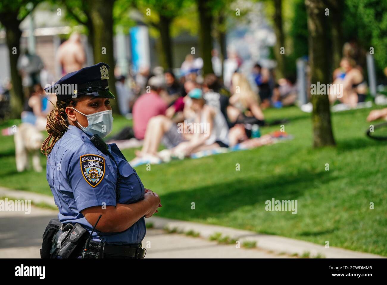 New York, USA. 16th May, 2020. NYPD officer wearing a face mask as a ...