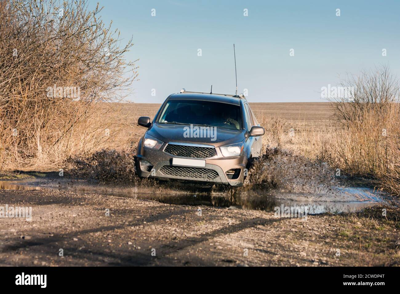 Pick up car rides on the mud puddle Stock Photo - Alamy