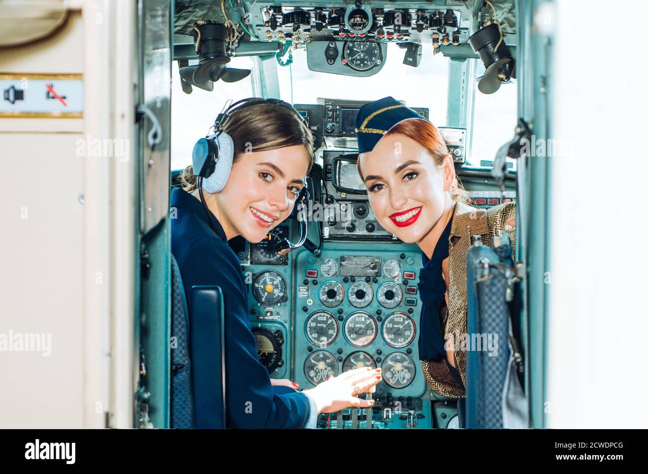 Back view from the inside of the plane. Portrait of two attractive ...