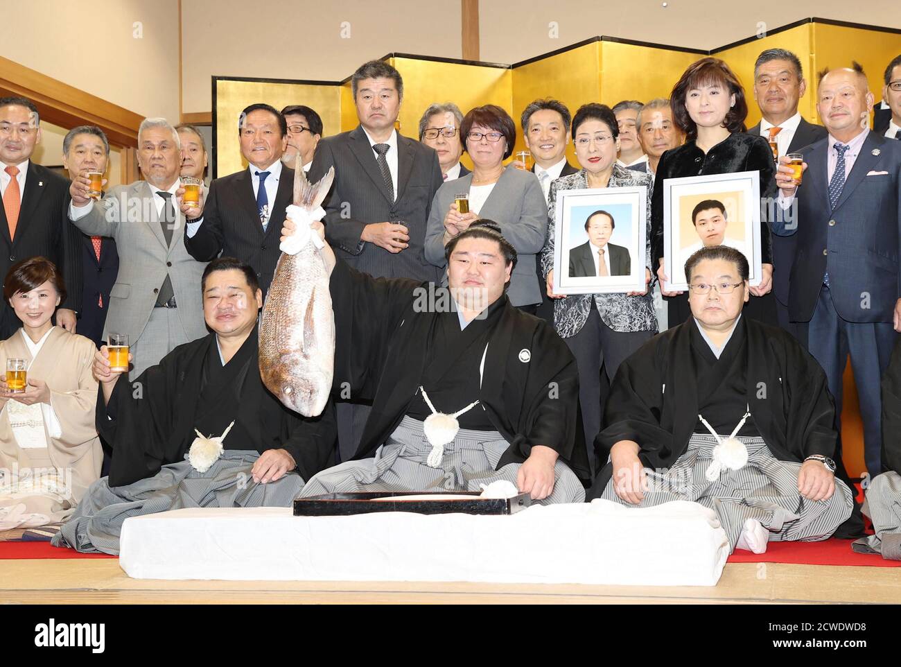 Sumo wrestler Shodai (2nd from R, front row) celebrates his promotion ...