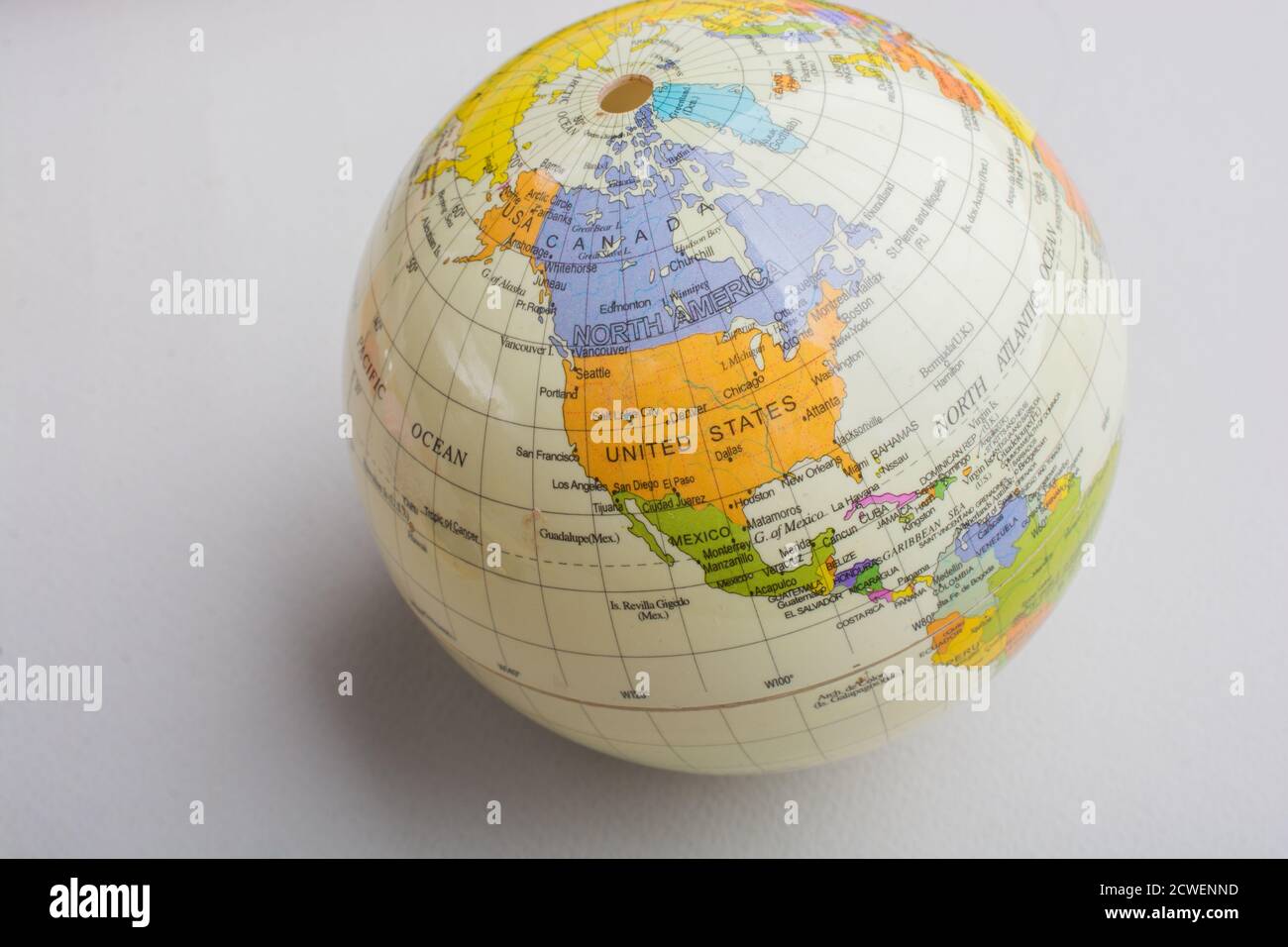 Close-up of a globe model on a white background Stock Photo - Alamy