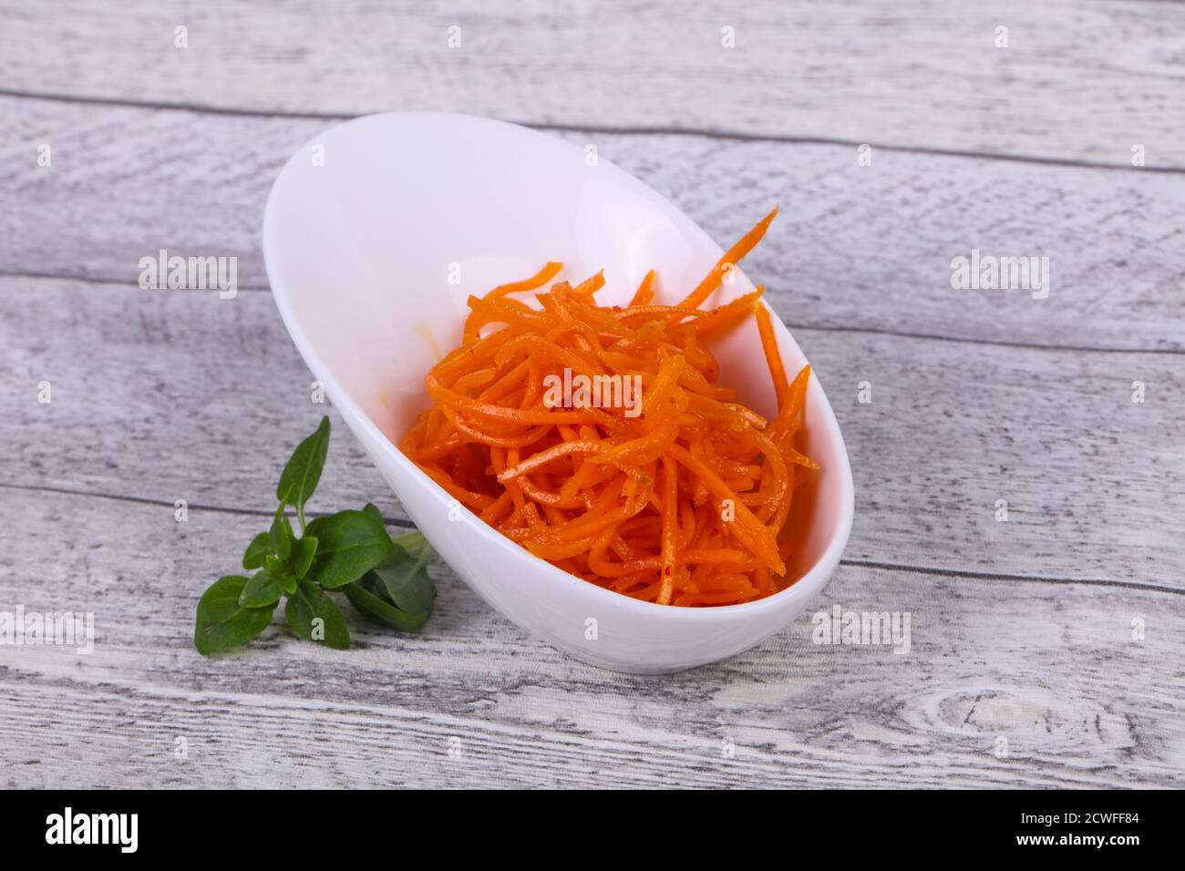 Korean cattot snack salad in the bowl served basil leaves Stock Photo ...