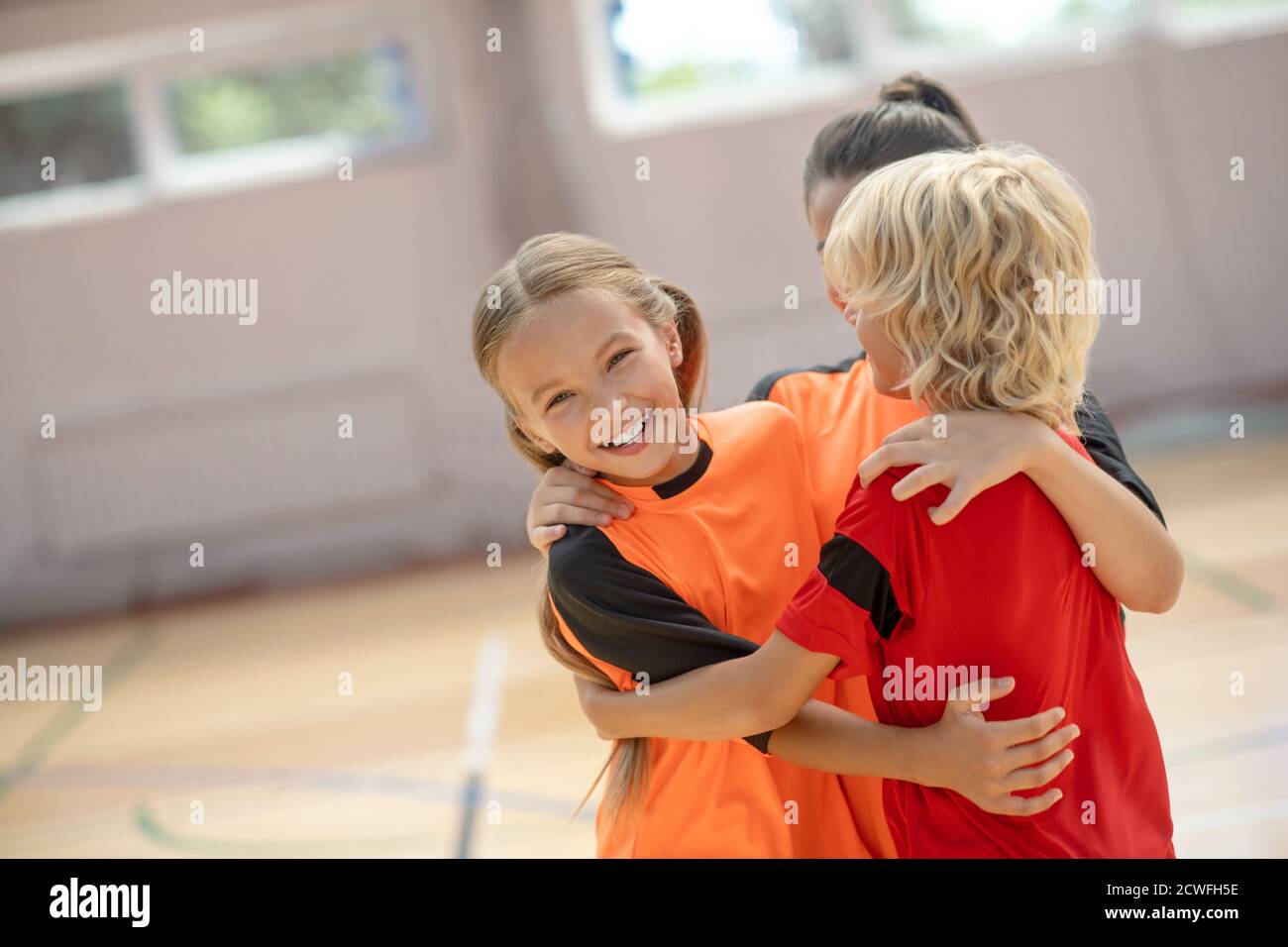 Group of kids hugging hi-res stock photography and images - Alamy