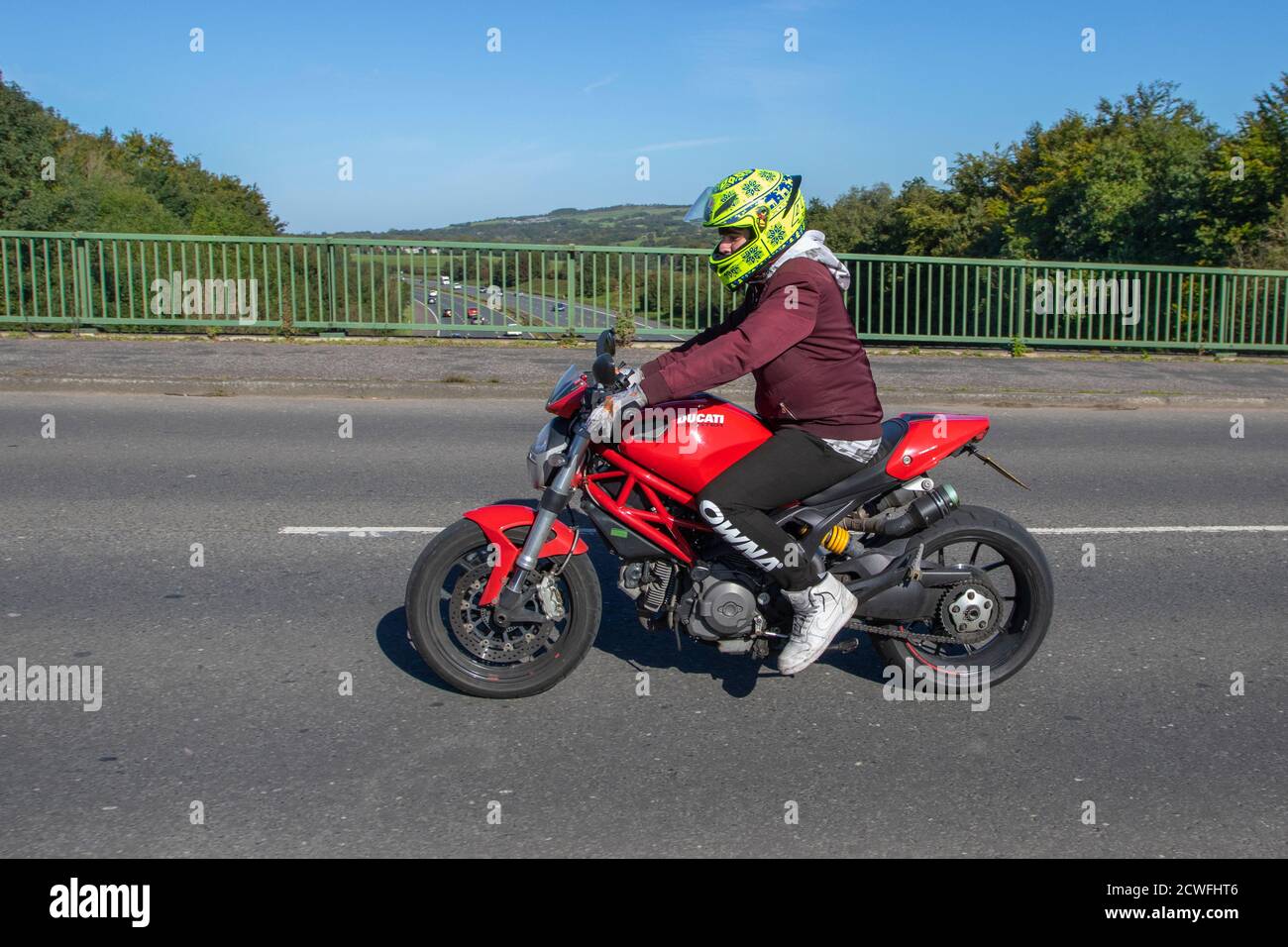 Red Ducati monster Motorbike rider; two wheeled transport, motorcycles ...