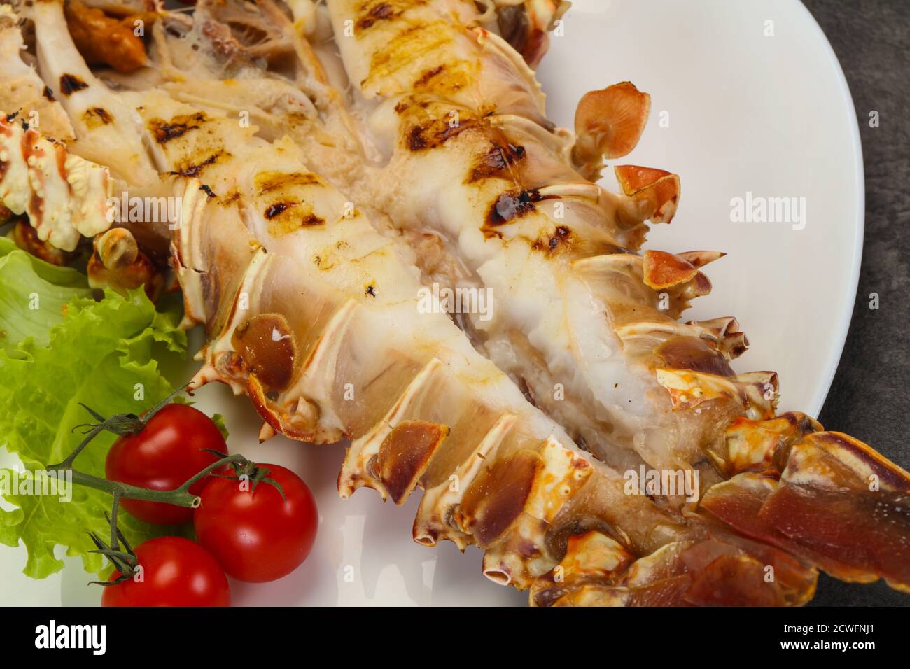 Grilled crayfish in the plate served salad Stock Photo - Alamy