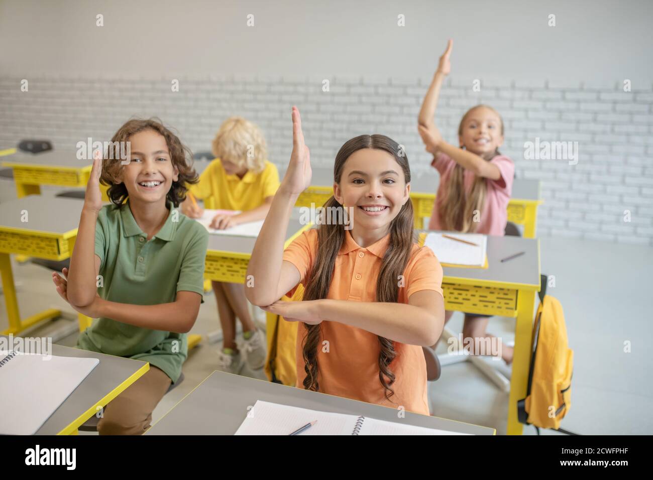 Children hands raised classroom hi-res stock photography and images - Alamy