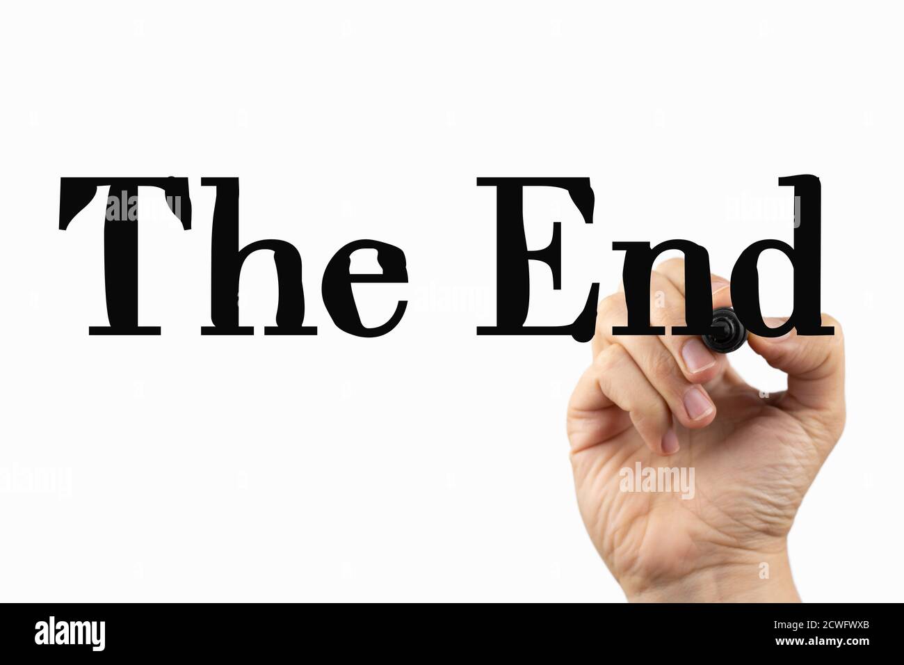 The End. Phrase on a whiteboard, written with black marker in a hand ...