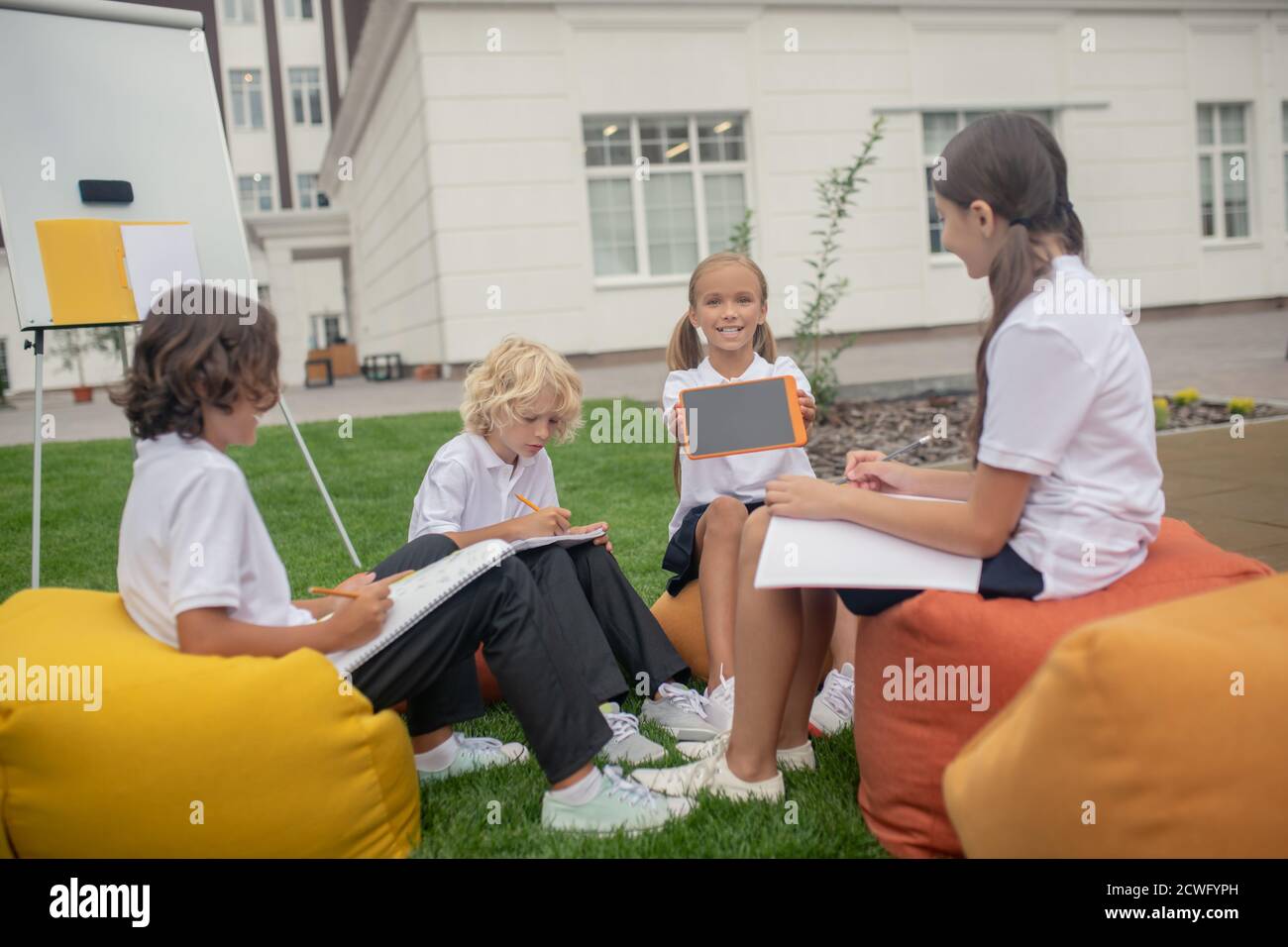 Children talking together school hi-res stock photography and images ...