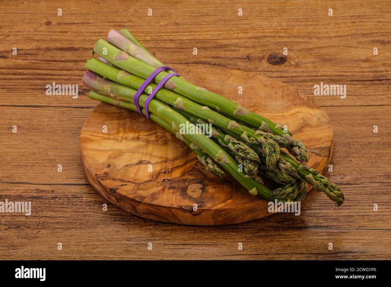 Vegan cuisine - Raw asparagus heap for cooking Stock Photo - Alamy