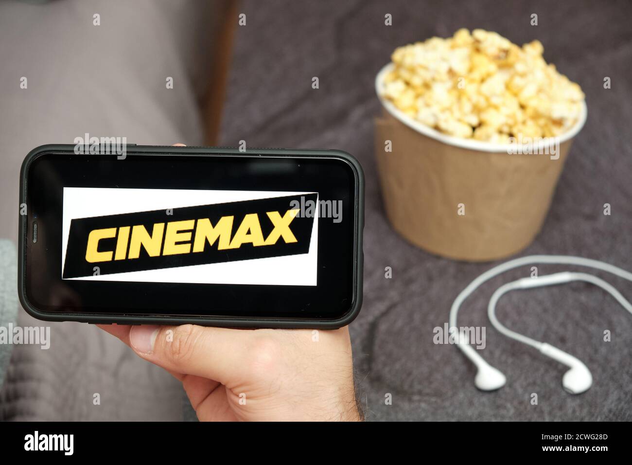 Cinemax logo on the mobile phone screen with popcorn box and Apple ...