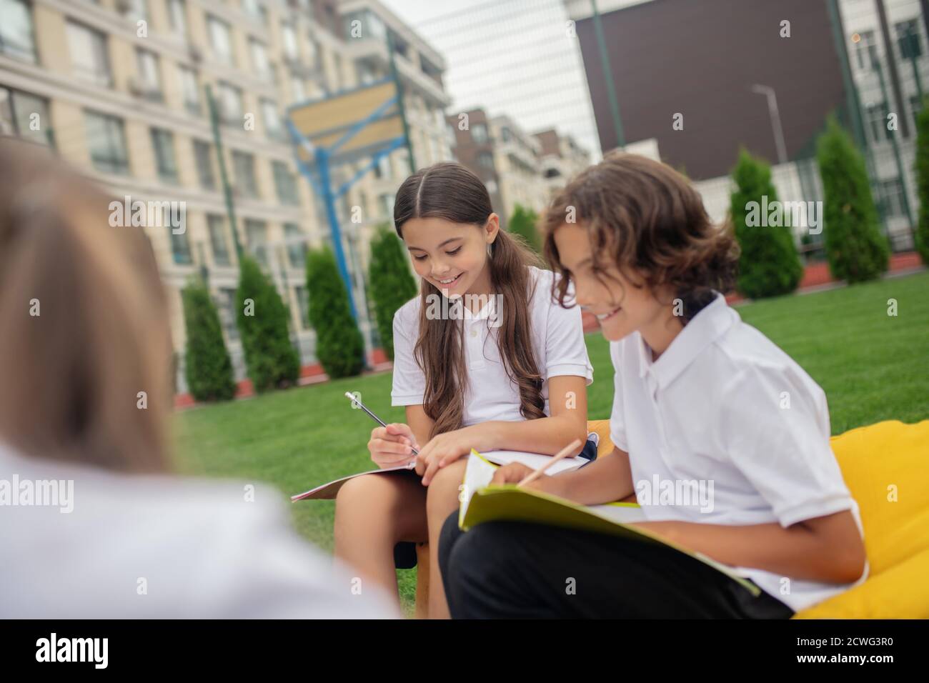 Excited children writing hi-res stock photography and images - Alamy