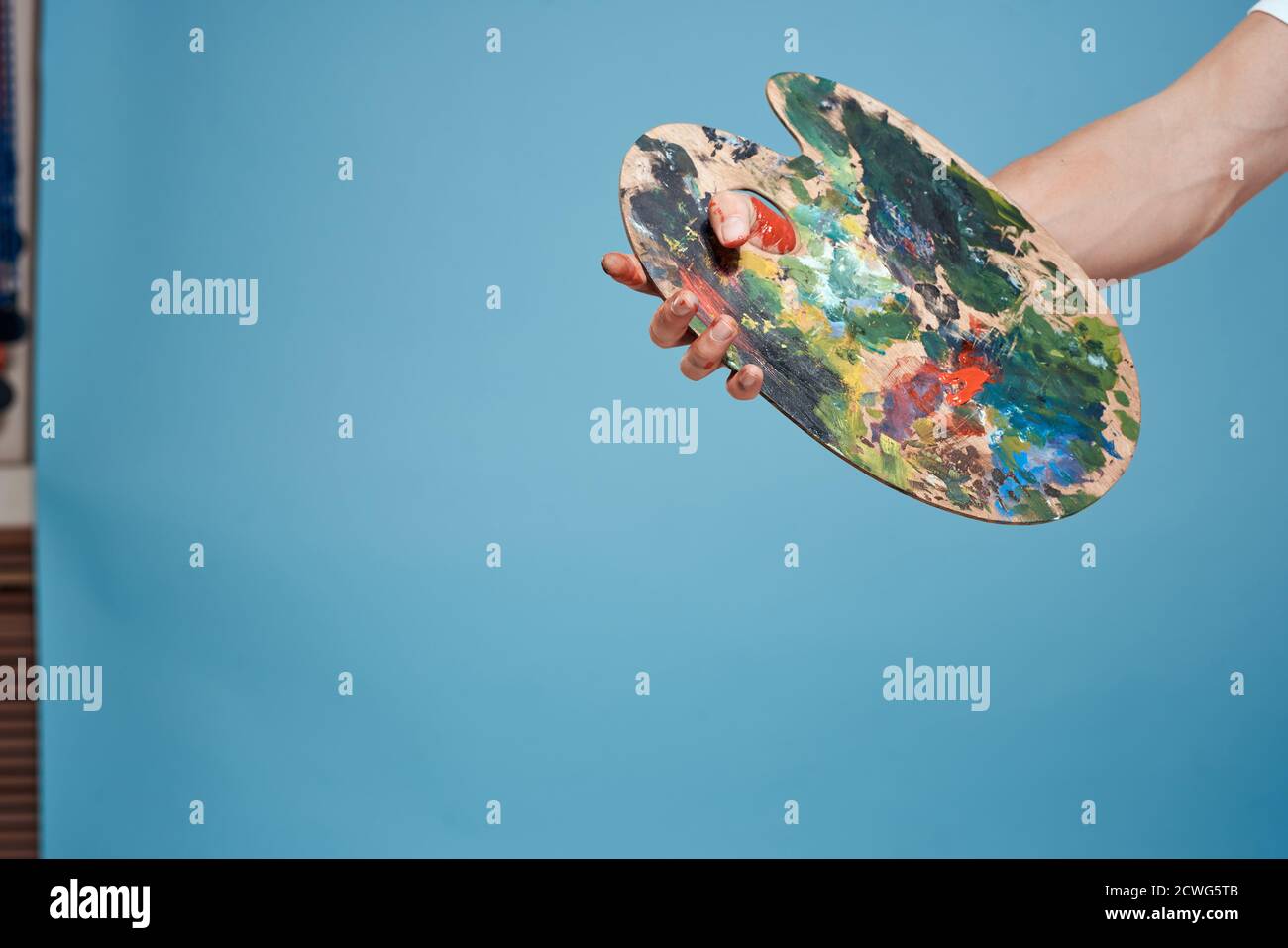 Palette in the hands of the artist paints art drawing creativity blue ...