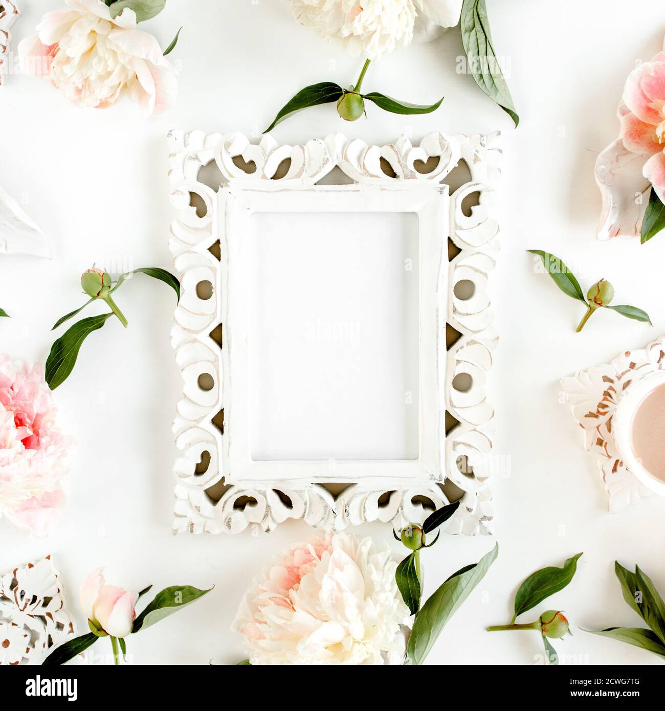 Carved, white frame decorated of beautiful pink peonies on white ...