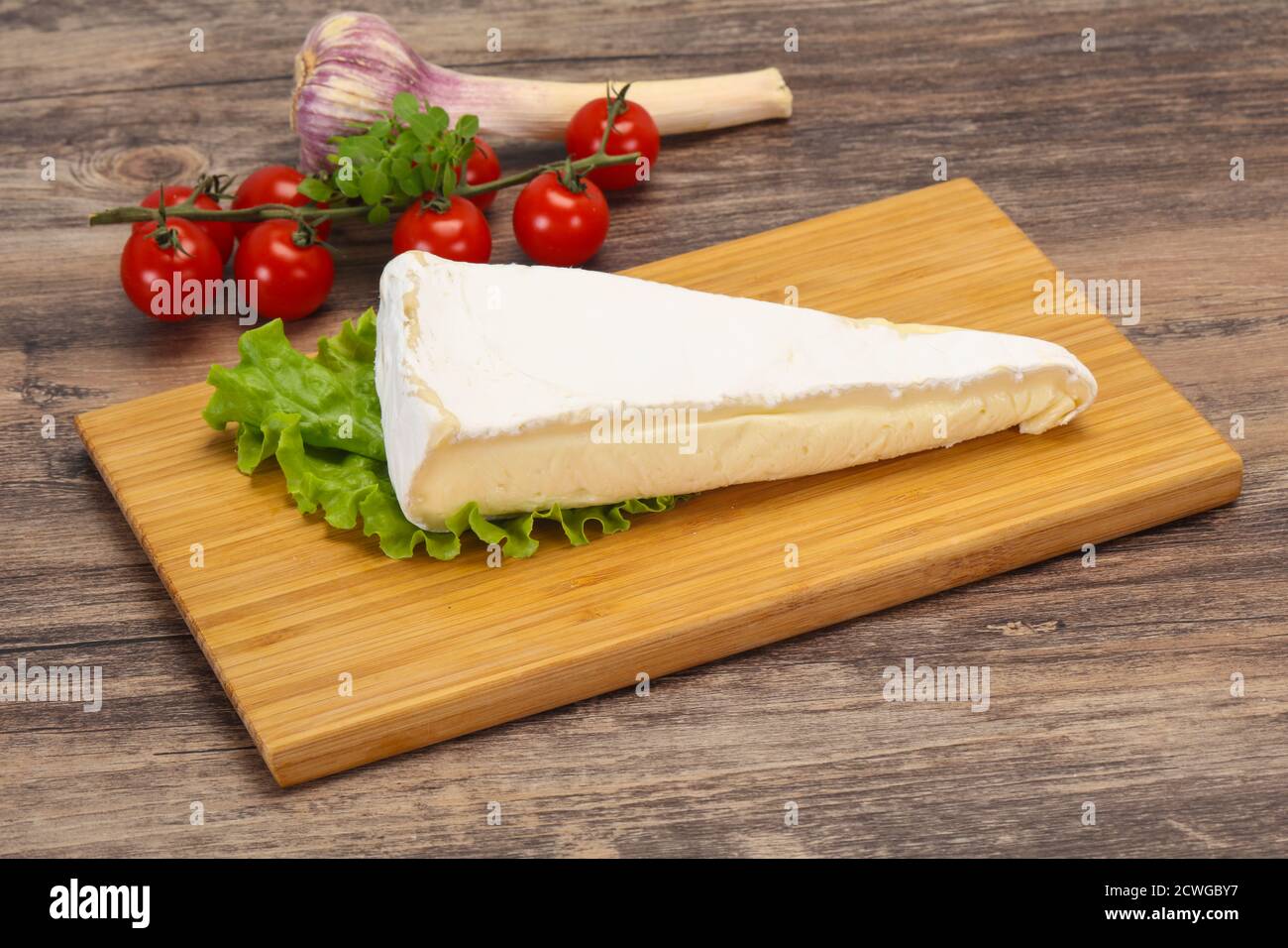 Brie cheese triangle served salad leaves Stock Photo - Alamy