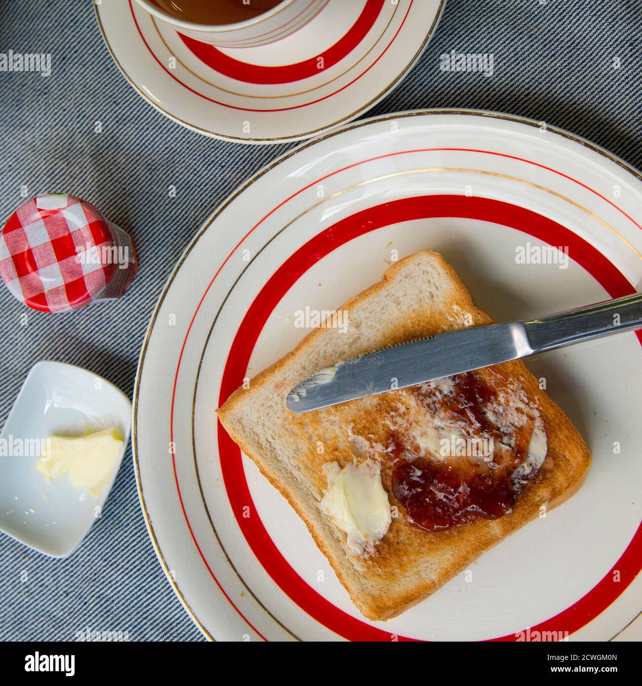 Toast with butter tea and red jam hi-res stock photography and images ...