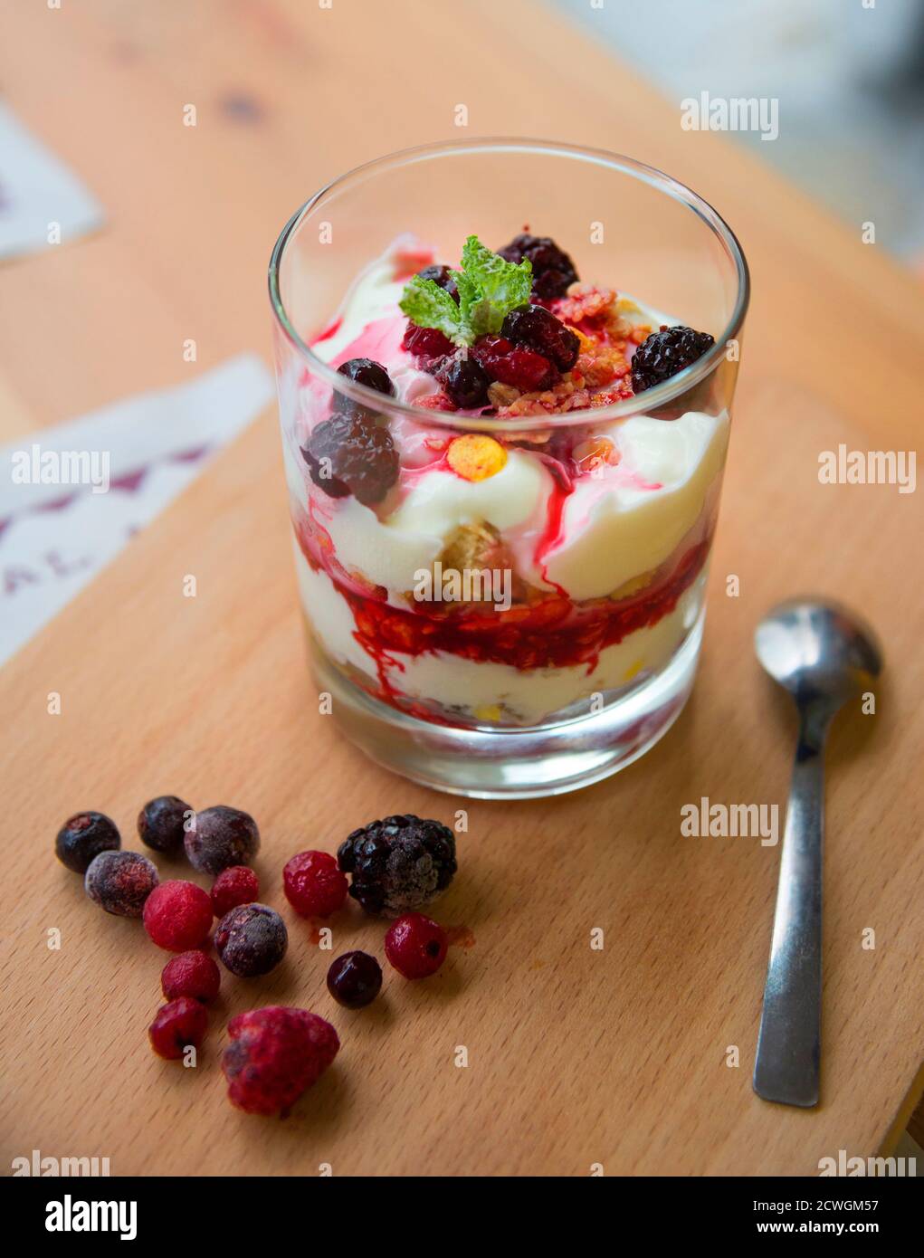 Greek yogurt with cereal and fruits Stock Photo - Alamy