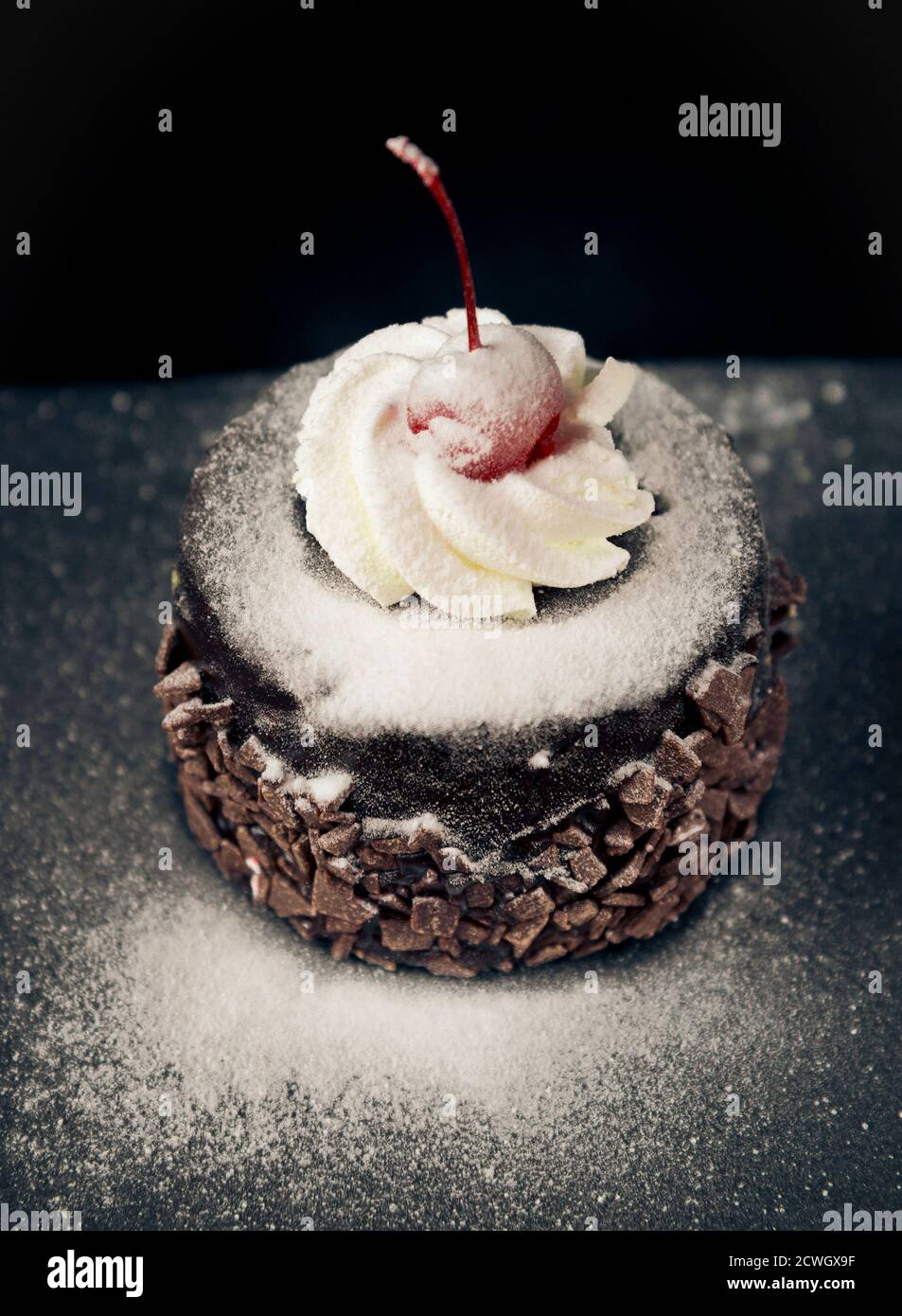 Delicious chocolate cake with cherry on the top icing Stock Photo - Alamy