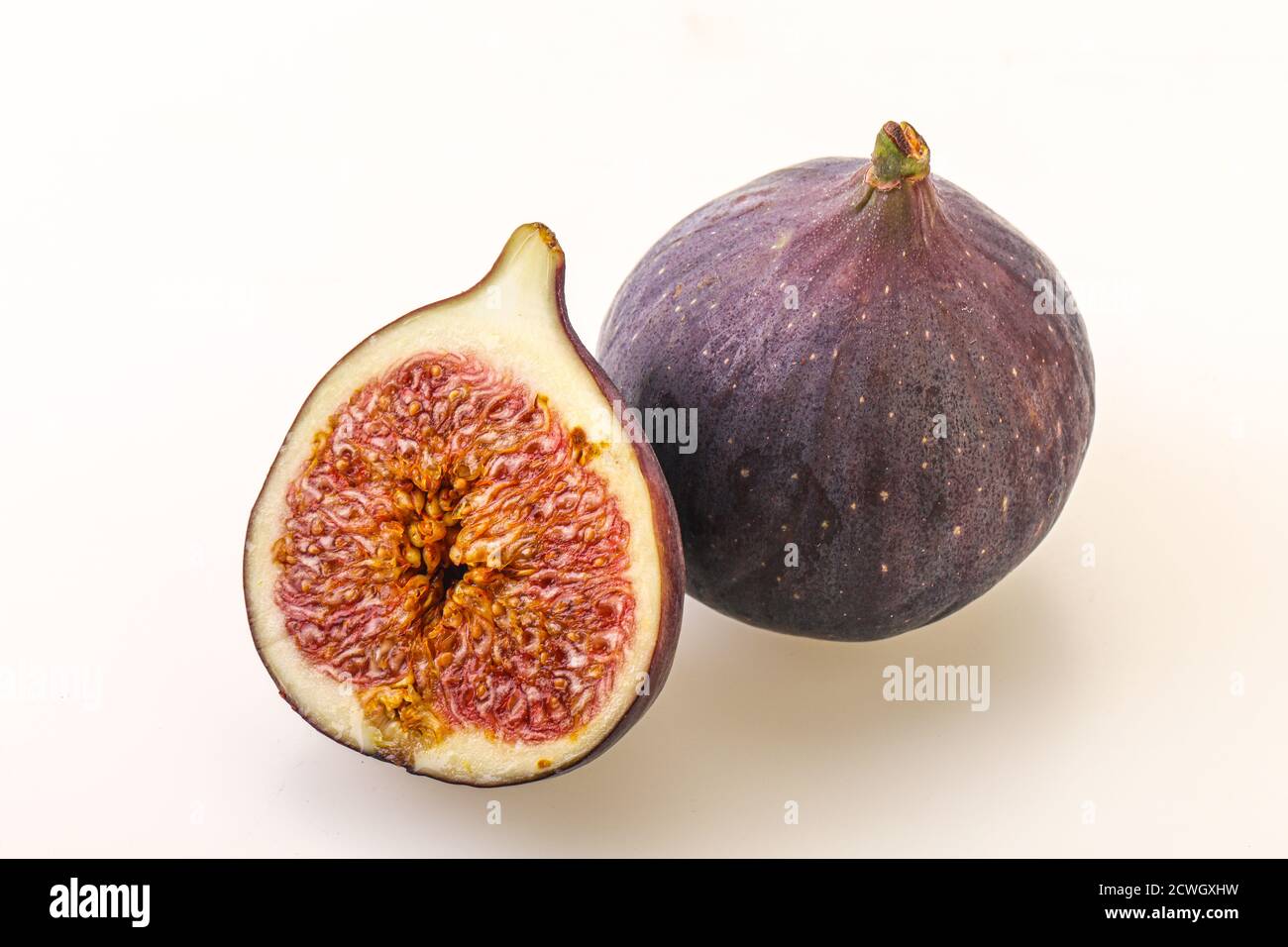 Sweet purple slice of fig fruit Stock Photo - Alamy