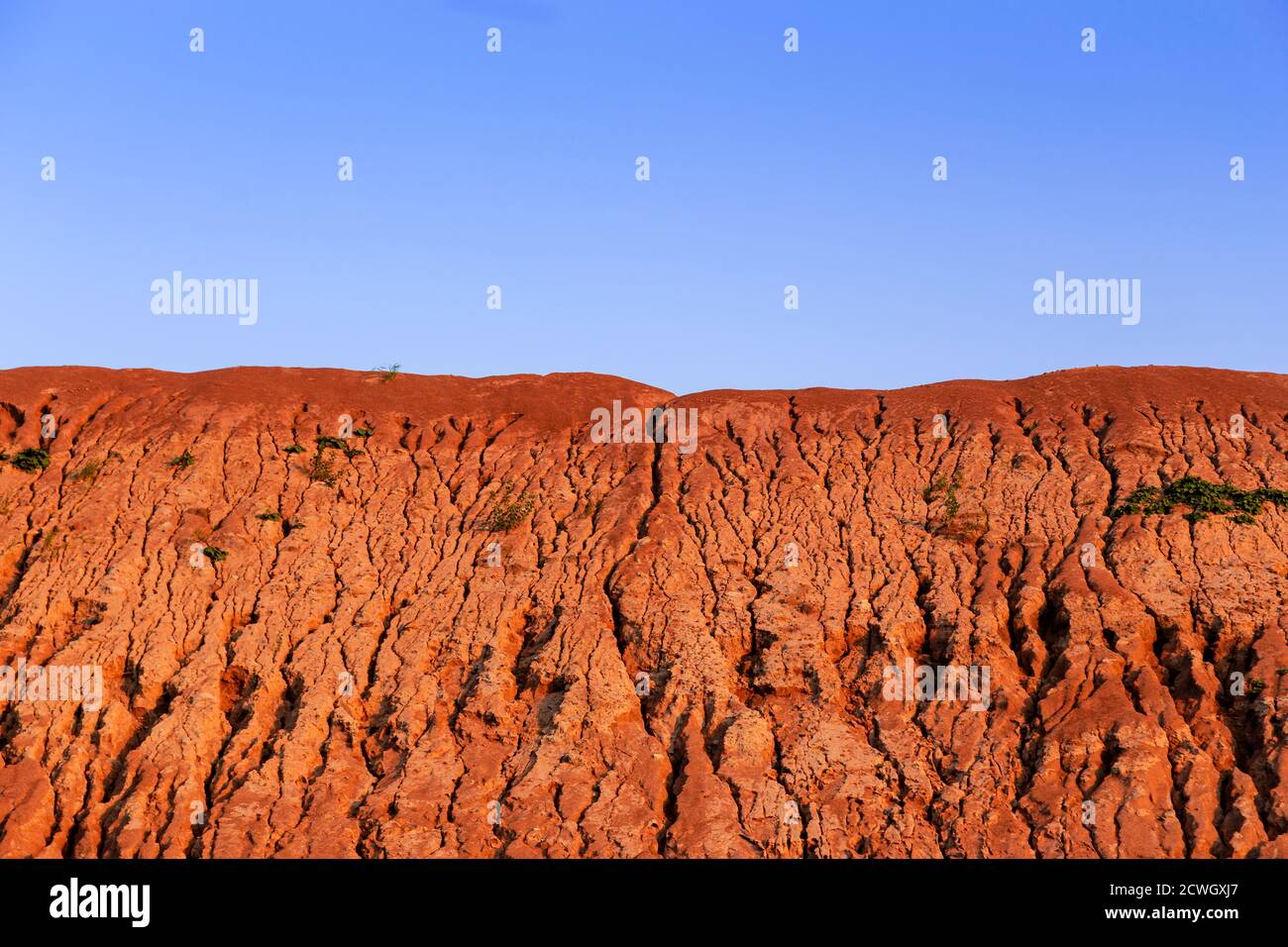 Red Rough Geological Formation Detail with blue sky. Natural canyon ...