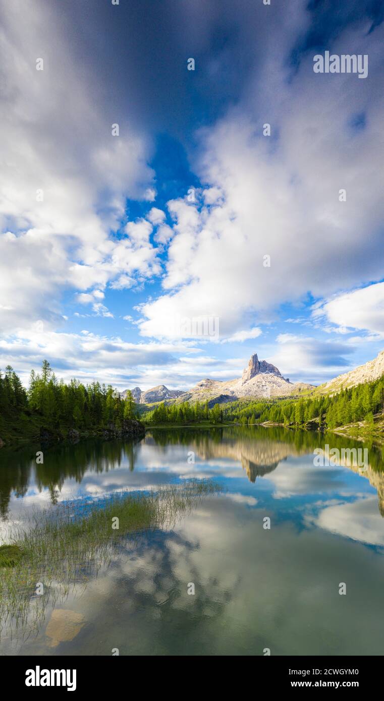 Clouds mirrored in Lake Federa with Becco di Mezzodi on background ...
