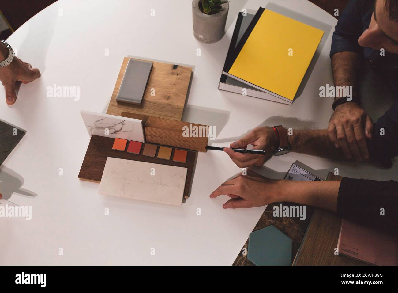 Close up of hands on the table during an office presentation with three ...