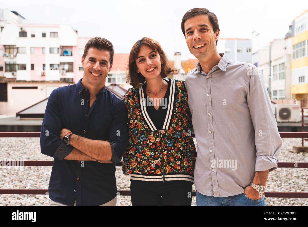 Three beautiful architects posing for a photo outside their office ...