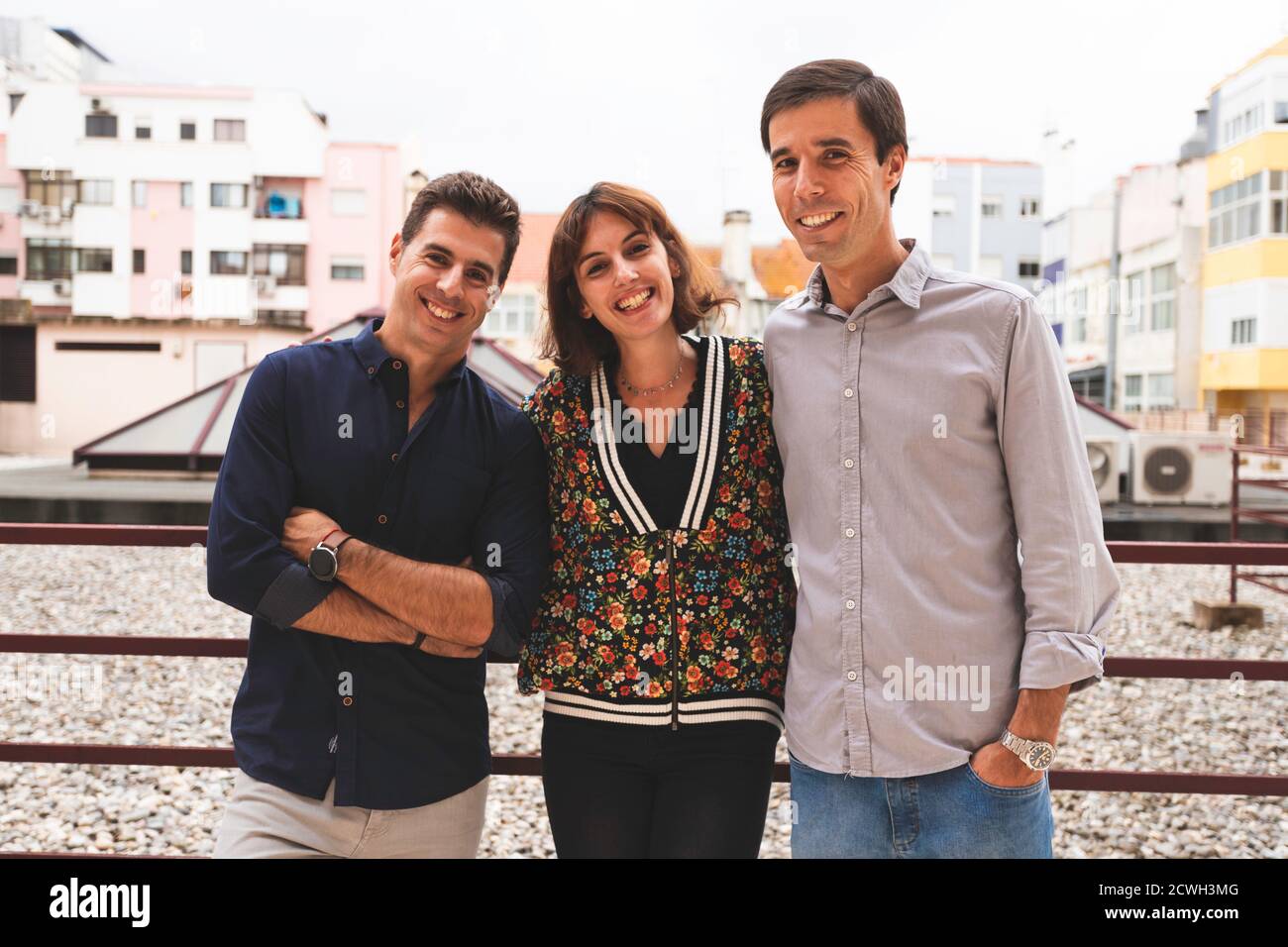 Three beautiful architects posing for a photo outside their office ...