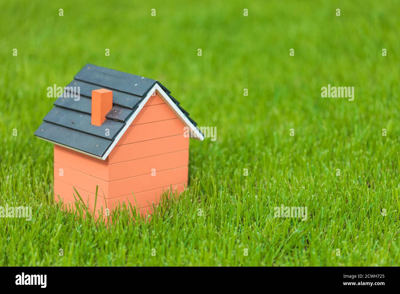little toy house in the grass, summer day Stock Photo - Alamy