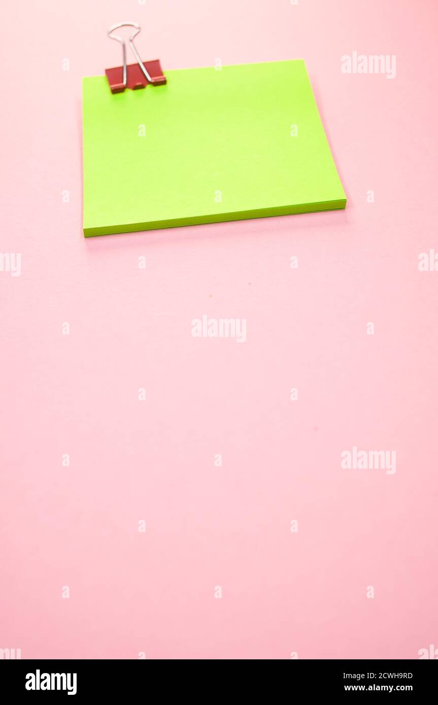 Closeup shot of the paper clip on the notepad on the pink surface Stock ...
