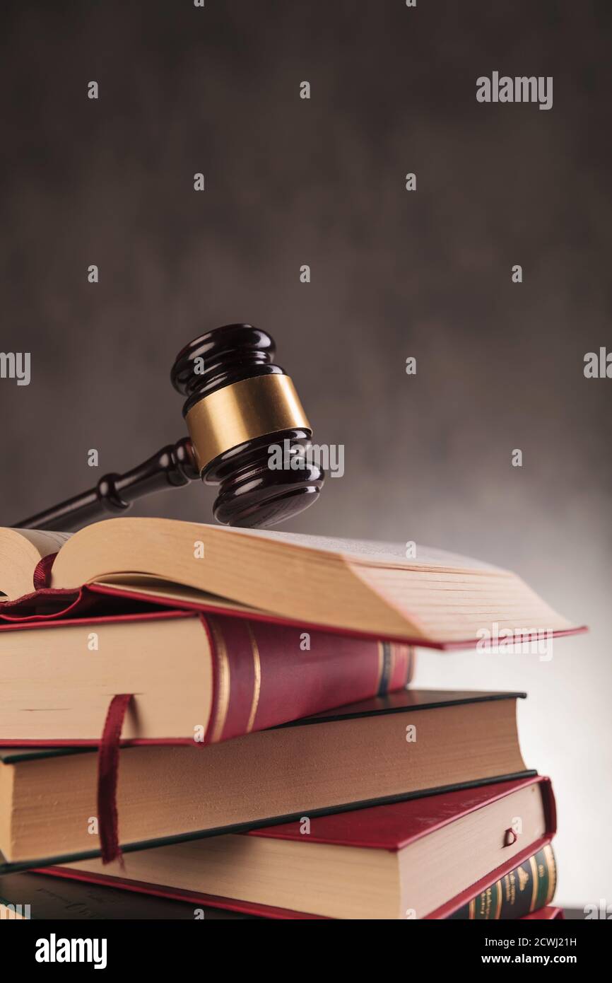 wooden hammer of a judge on a pile of books, studying law concept Stock ...