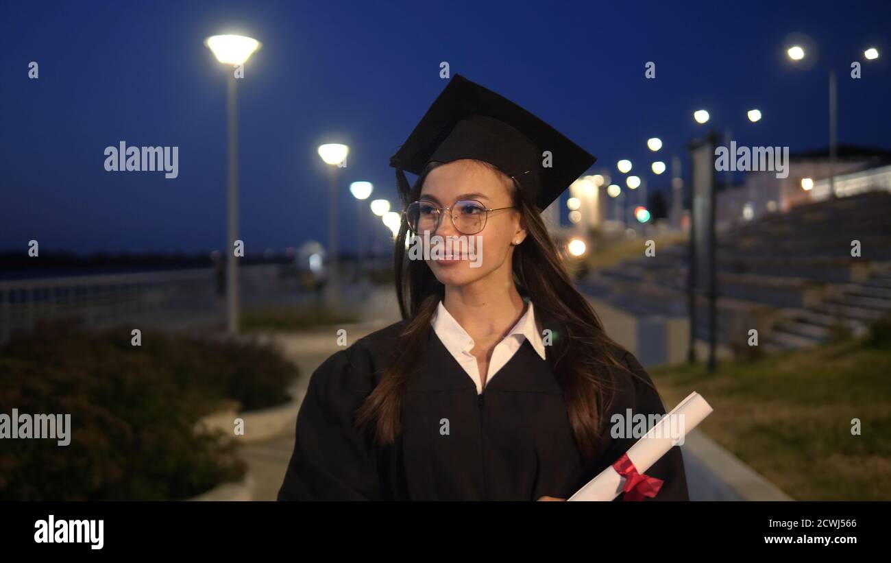 Elegant beauty girl student getting graduate from university walking in ...