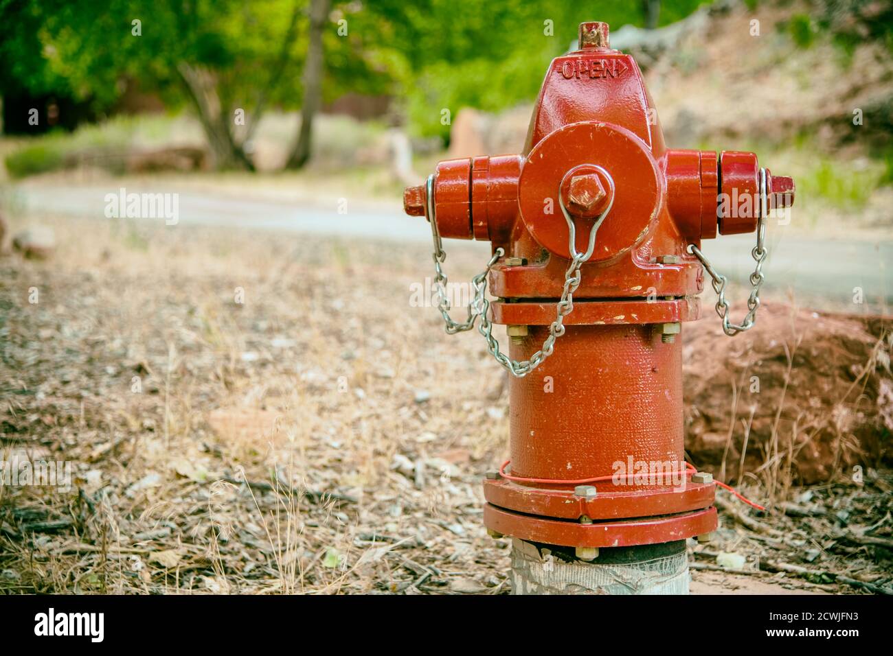 Red Hydrant at road border in the National Park Stock Photo - Alamy