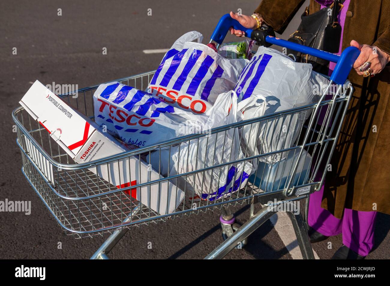 London, UK, November 19, 2011 : Customer shopper pushing a shopping ...