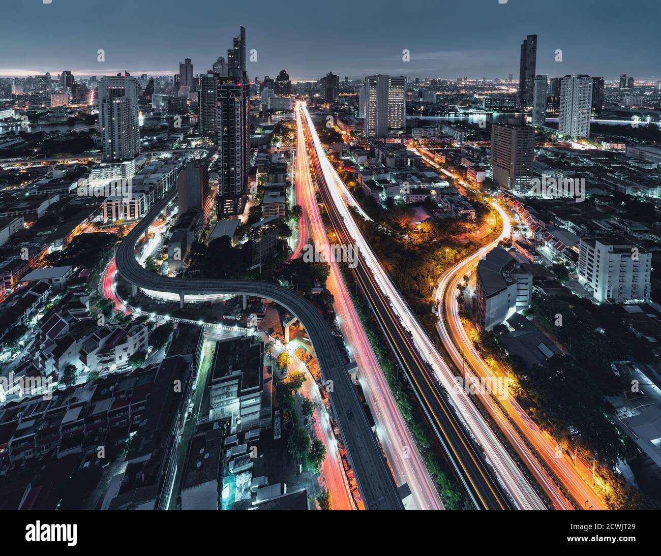 Aerial view of Trident road at Sathorn, Taksin bridge and illuminated ...