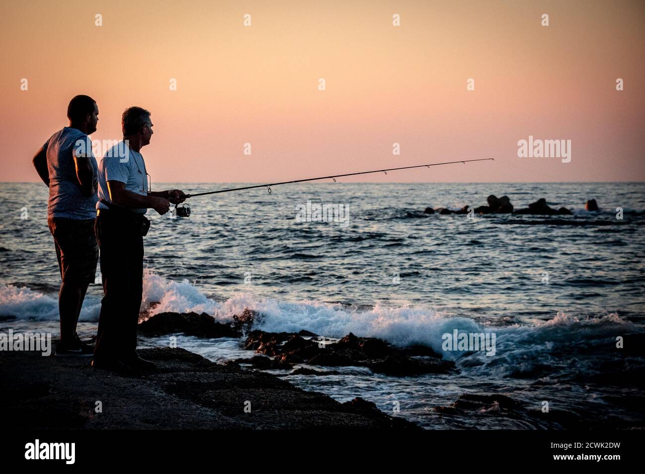 Two fishermen catch fish sea hi-res stock photography and images - Alamy