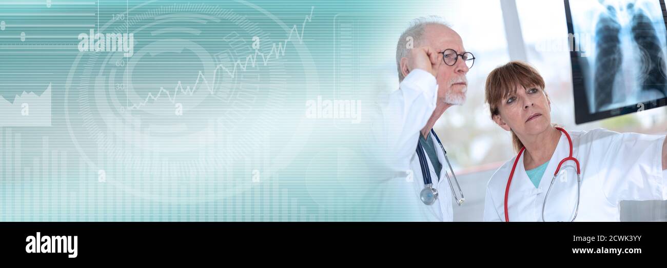 Two doctors examining x-ray report in medical office; panoramic banner ...