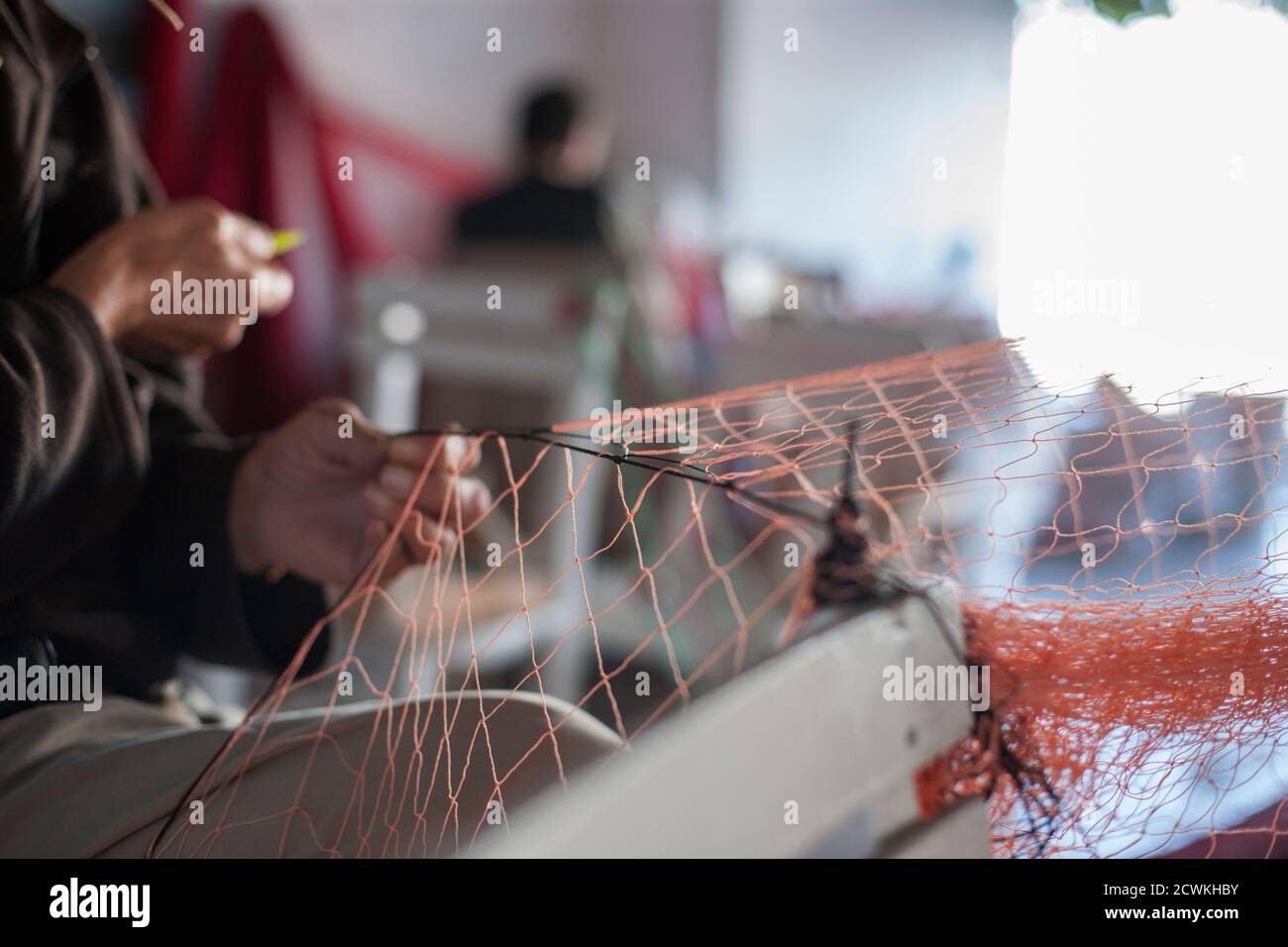 Net mending fisher hi-res stock photography and images - Alamy