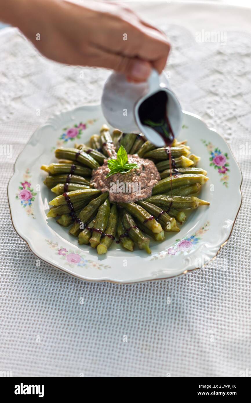 Braised Okra with Ground Meat and Pomegranate Syrup Stock Photo - Alamy