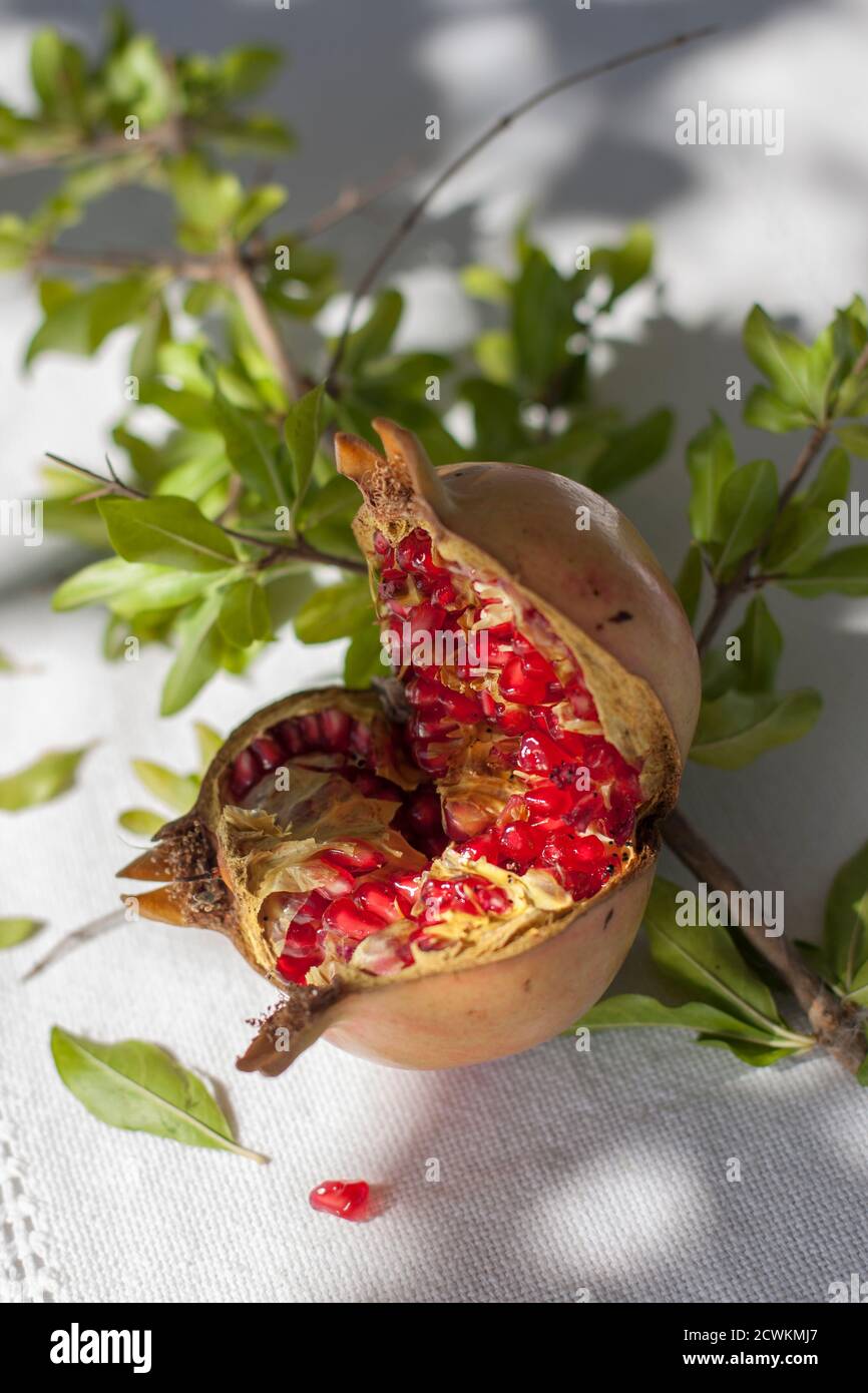 Open pomegranate on table hi-res stock photography and images - Alamy