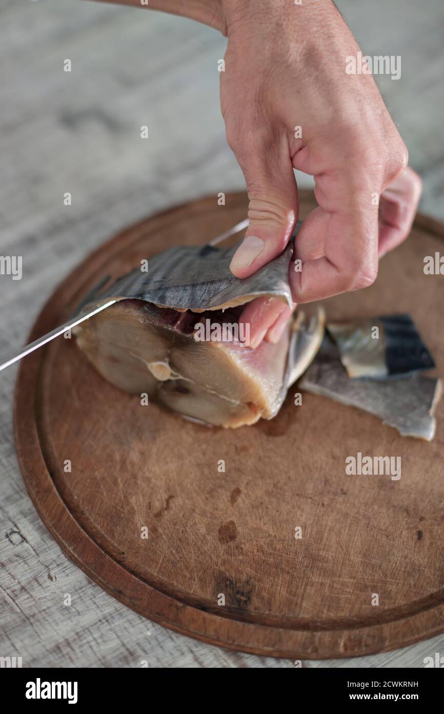 Hands slicing fish close up hi-res stock photography and images - Alamy