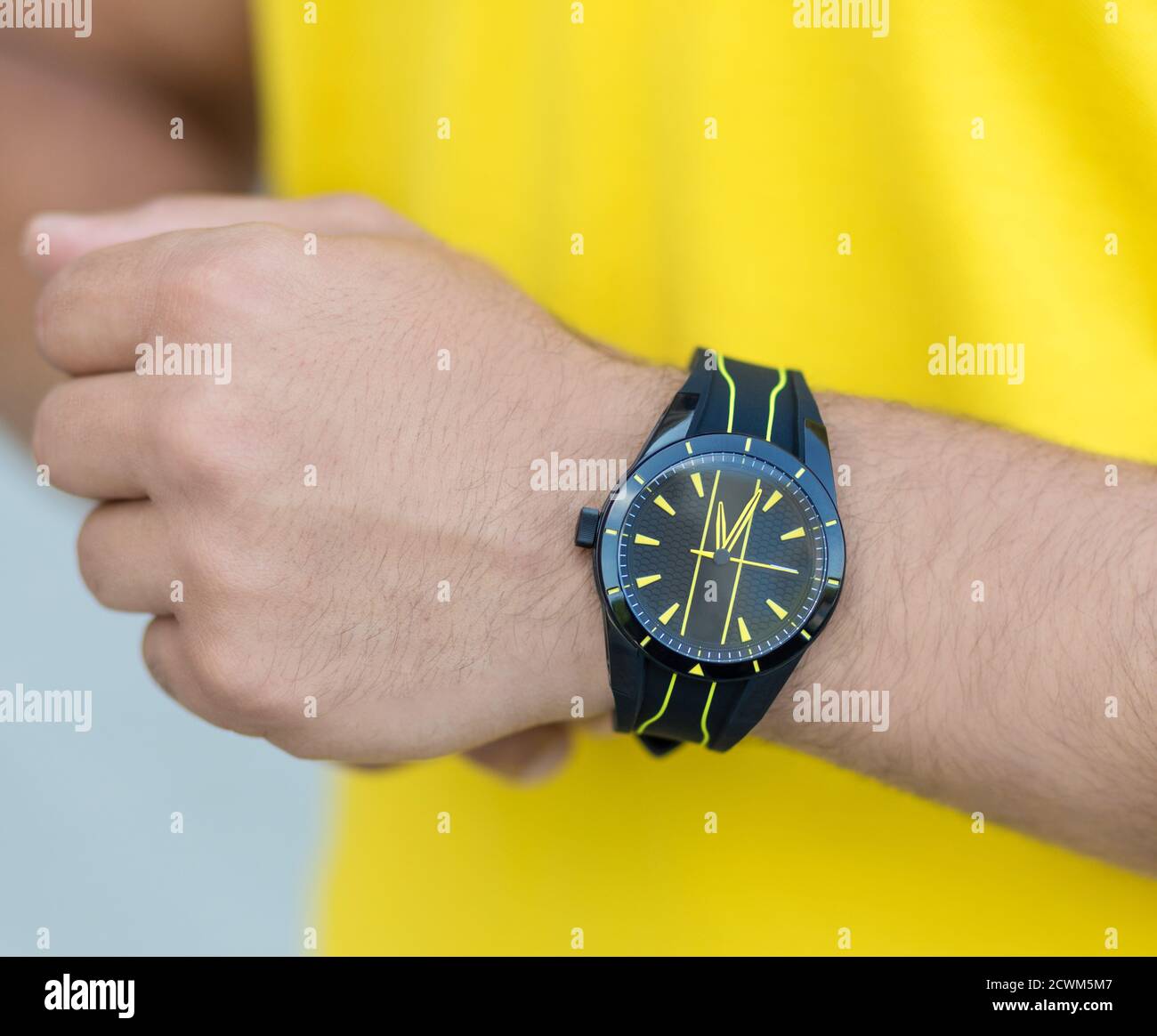 Luxury sport hand watch yellow dress man close up Stock Photo - Alamy