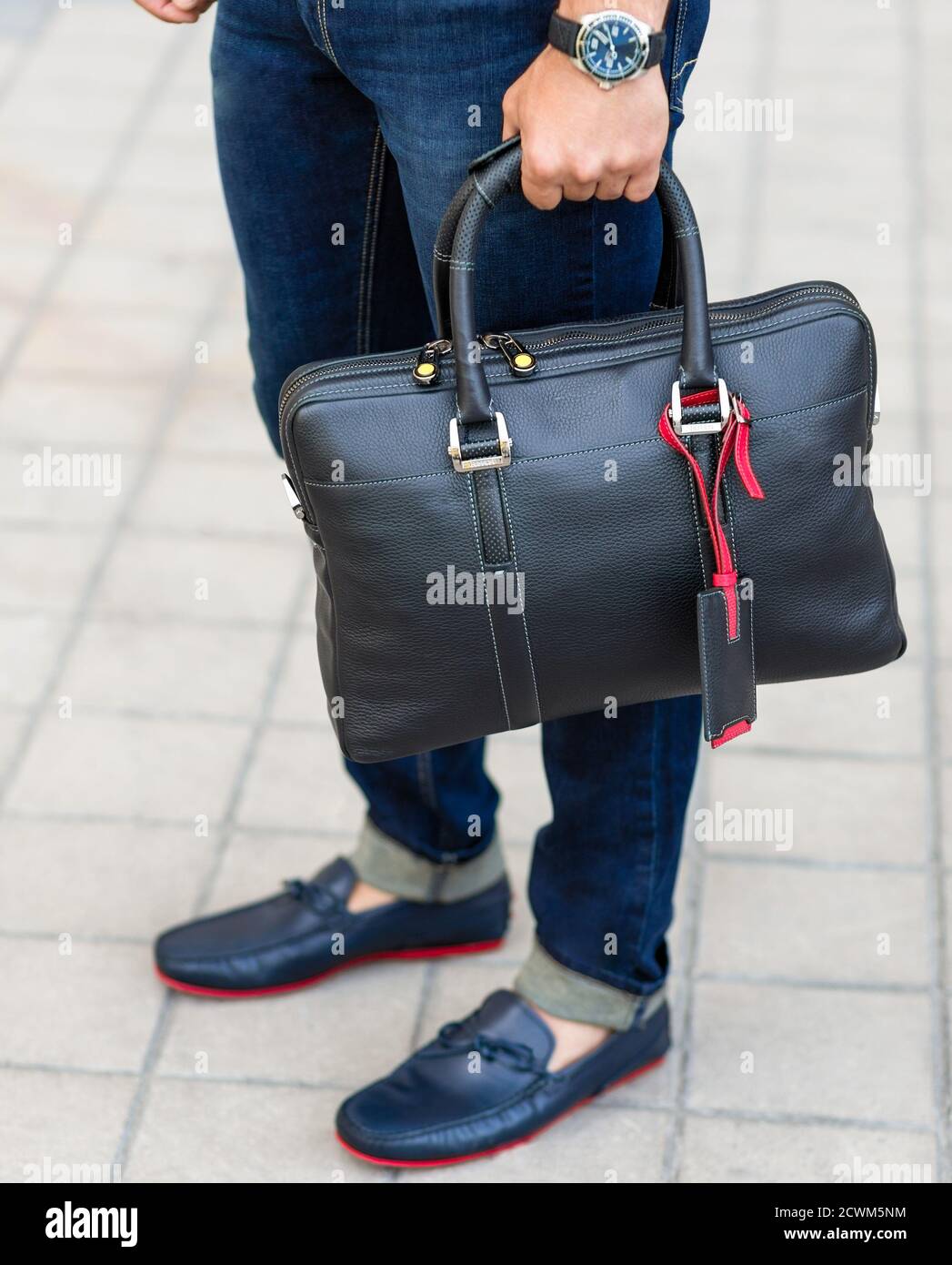 Black handbag man bag hi-res stock photography and images - Alamy