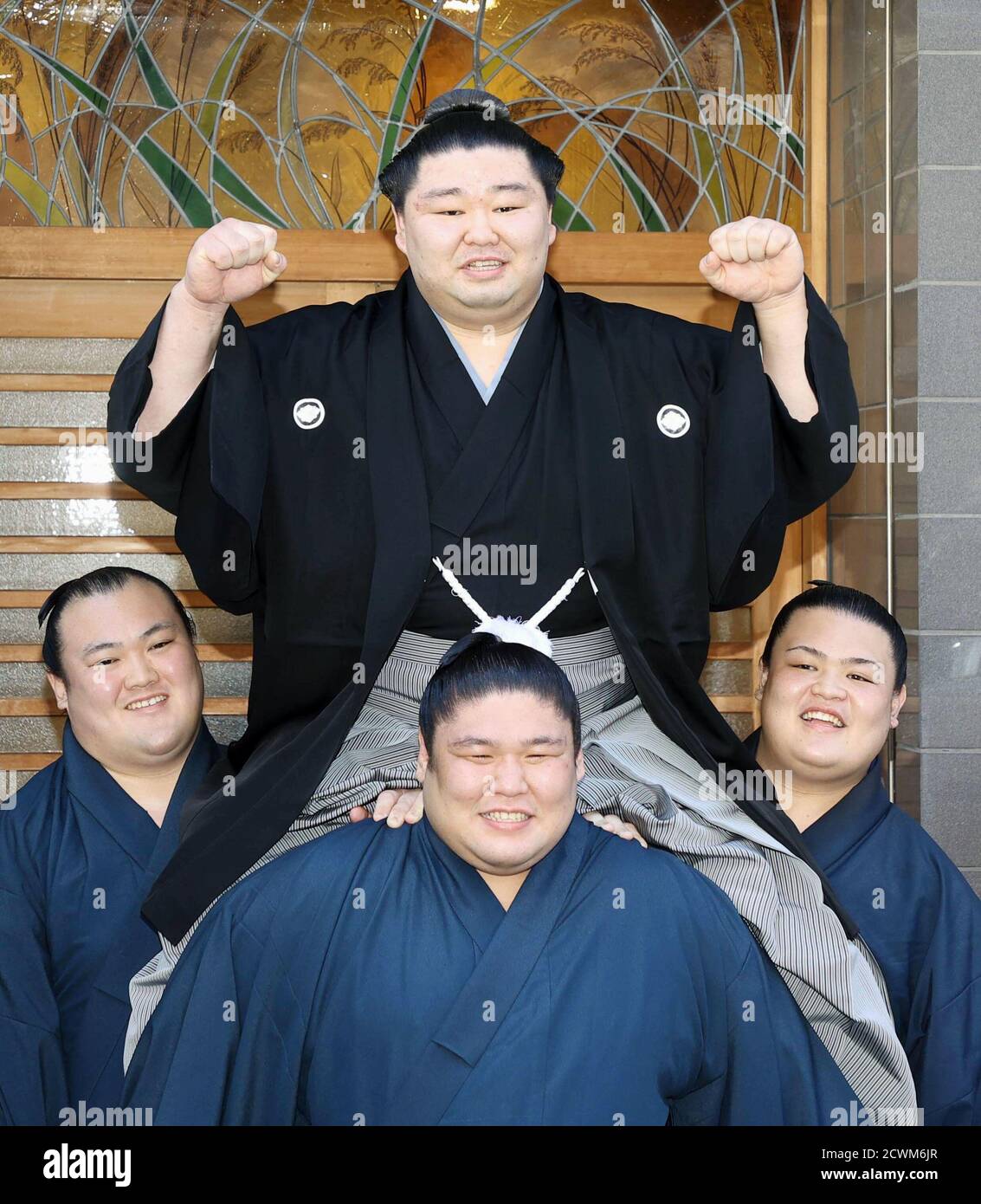 Sumo wrestler Shodai (top) celebrates his promotion to the sport's ...