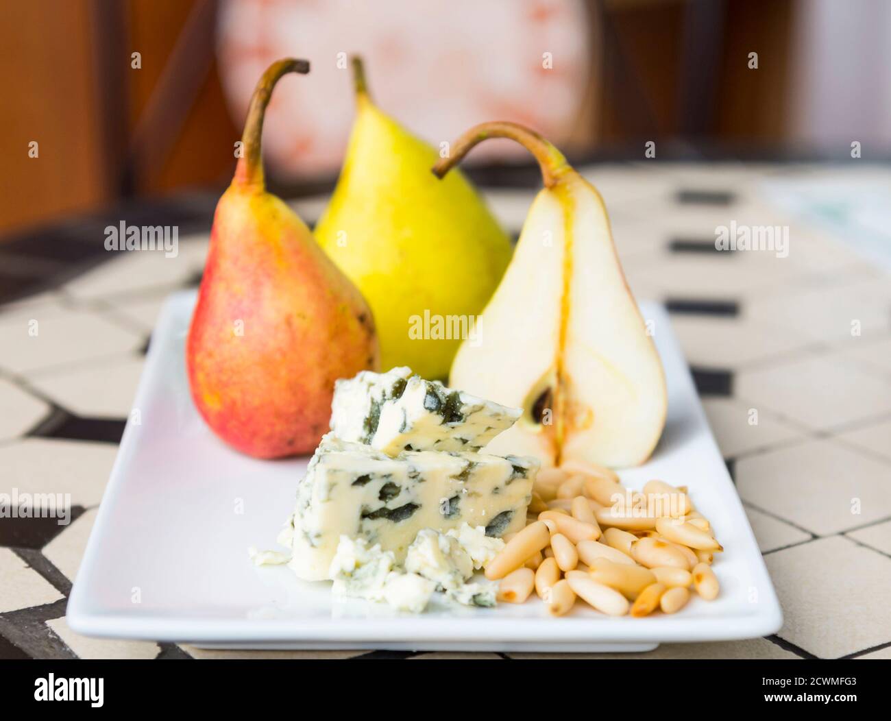 Blue cheese, pine nuts and pear Stock Photo - Alamy