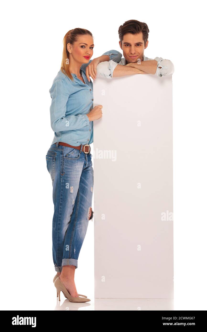 attractive man posing standing behind blank billboard in isolated ...