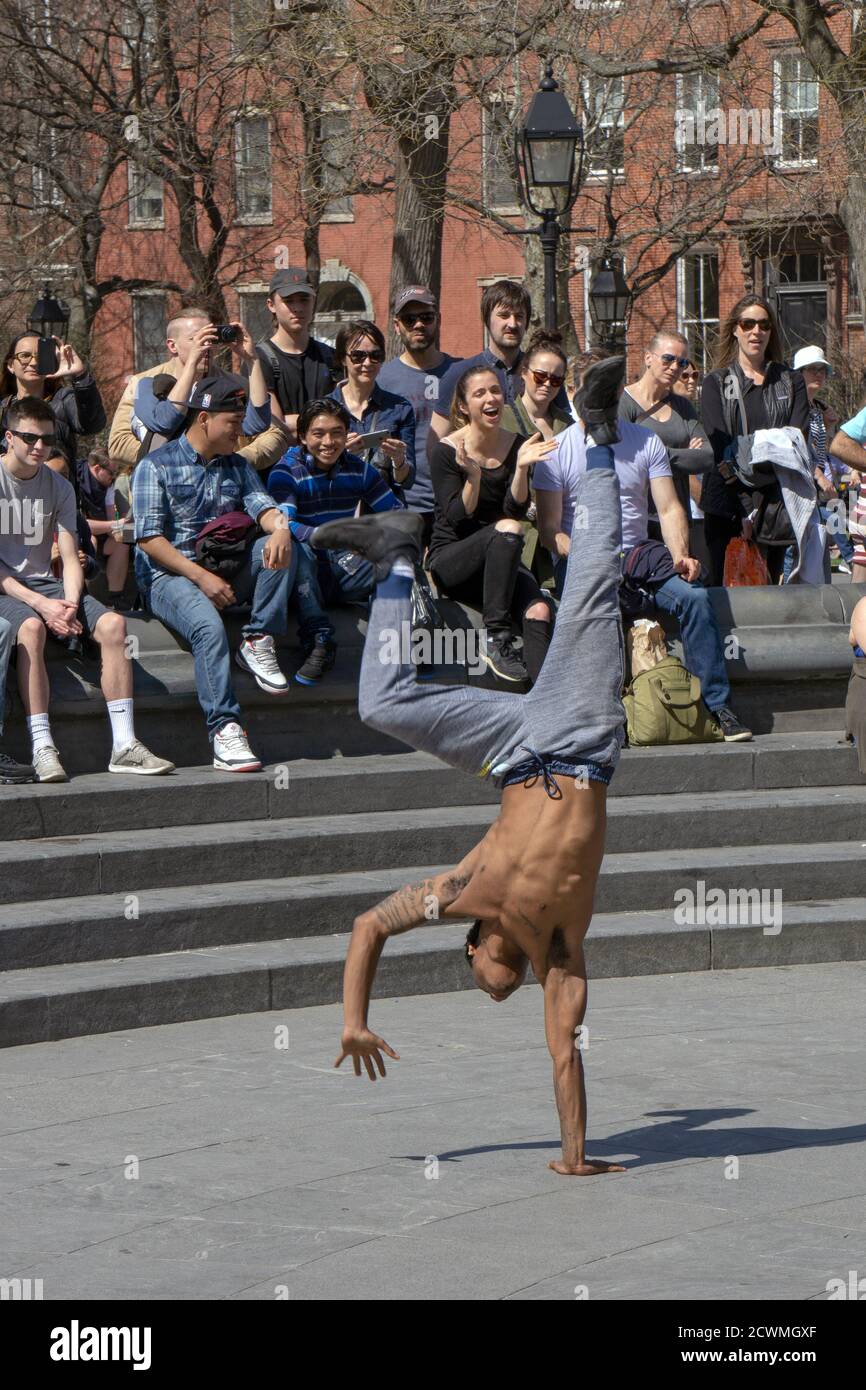 A fit muscular acrobatic dance & busker in Washington Square Park in ...