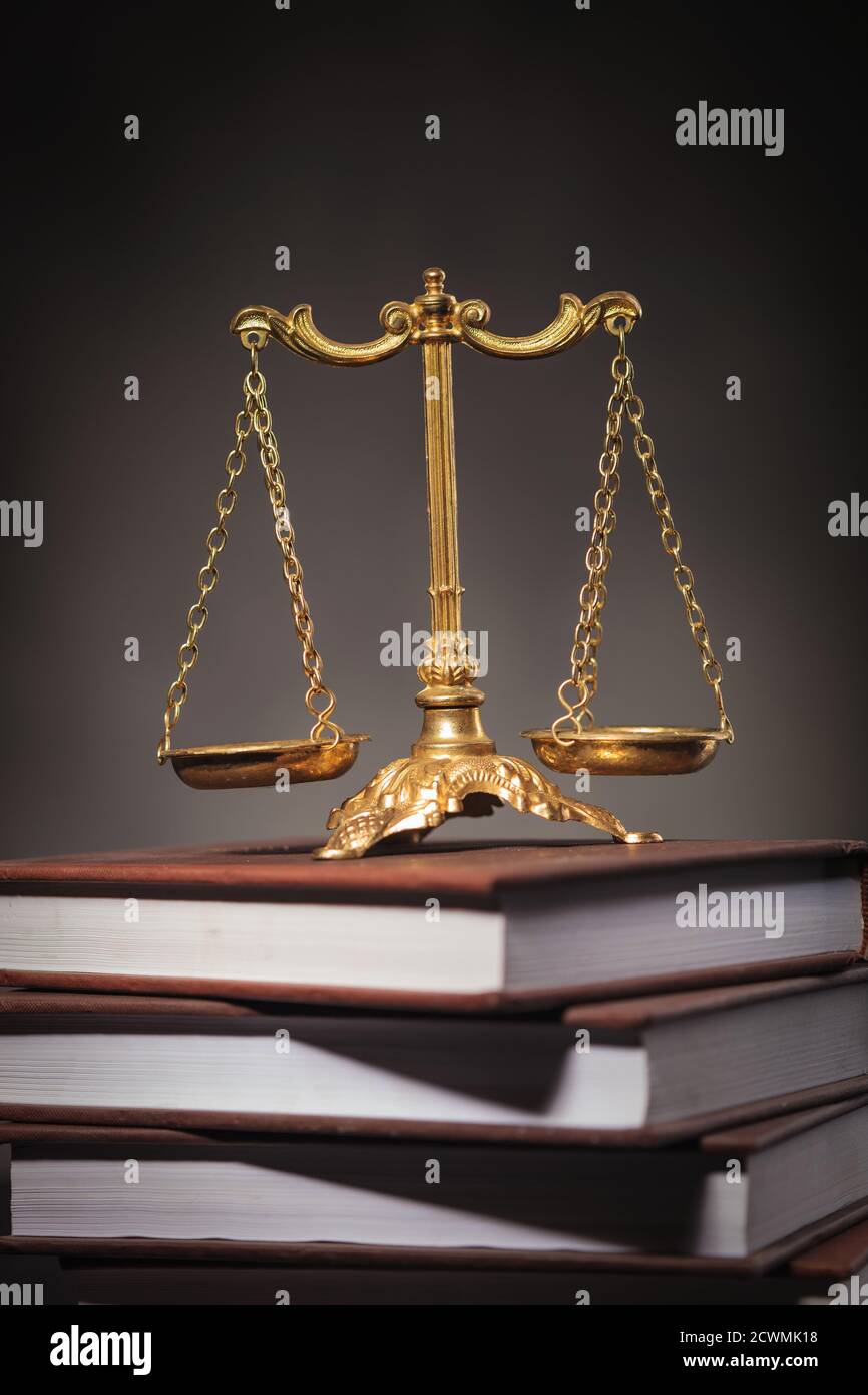 learning law concept, golden scale on a pile of books , studio picture ...